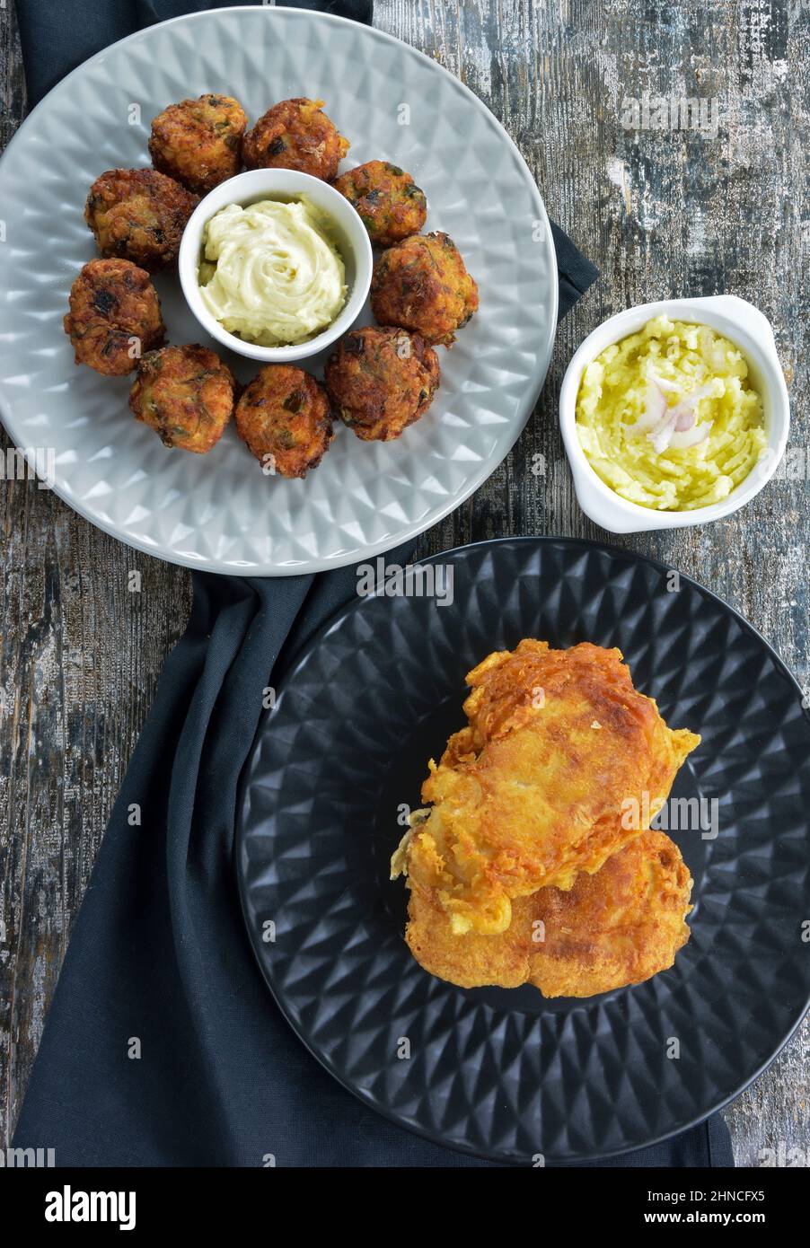 Two fillets of fried cod fish, croquettes of cod fish mayonnaise and ...