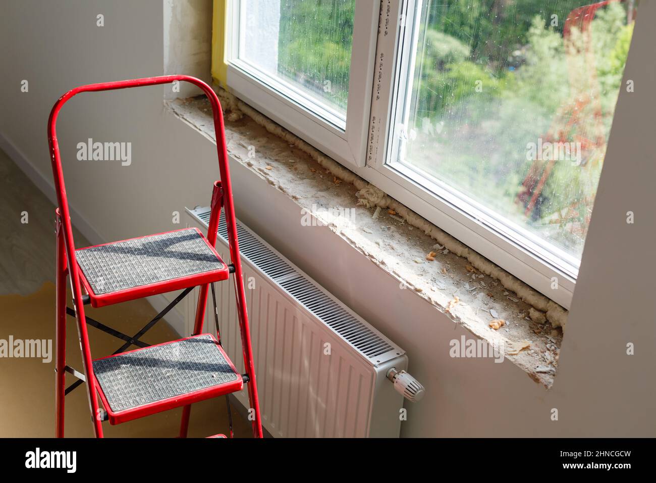 Installation of windows. Polyurethane foam on the slope of the window ...