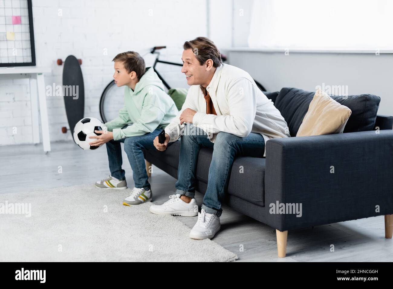Child football parent match hi-res stock photography and images - Alamy