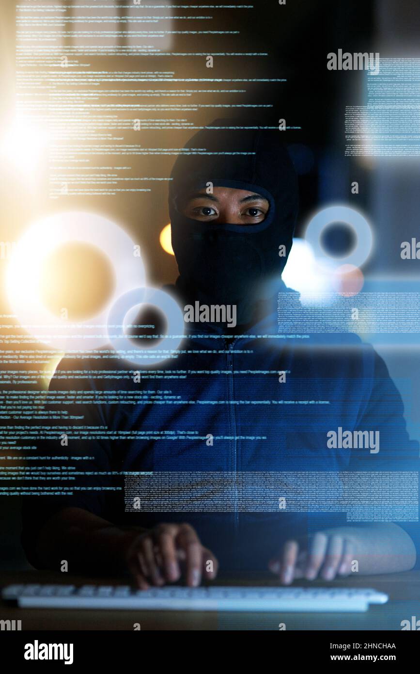 Hes got access to it all. Shot of a hacker cracking a computer code in the dark Stock Photo - Alamy