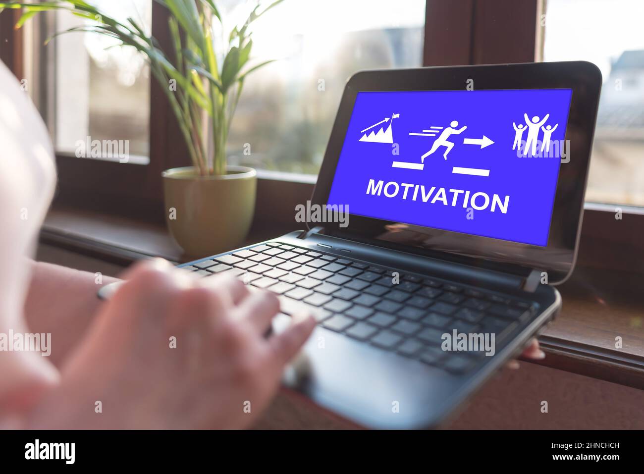 Laptop screen displaying a motivation concept Stock Photo - Alamy
