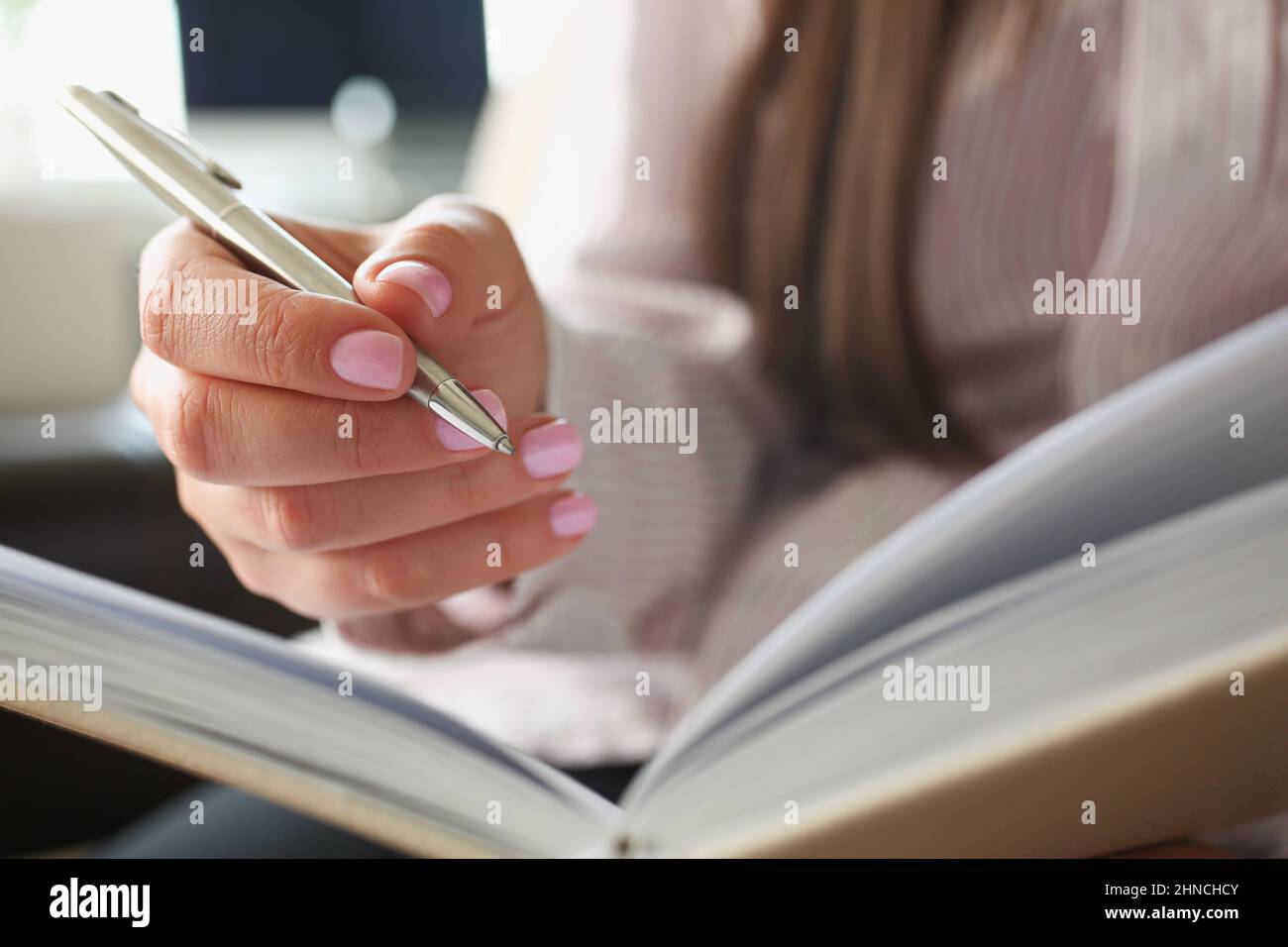 Female hand writing down ideas in personal diary, creative girl express ...