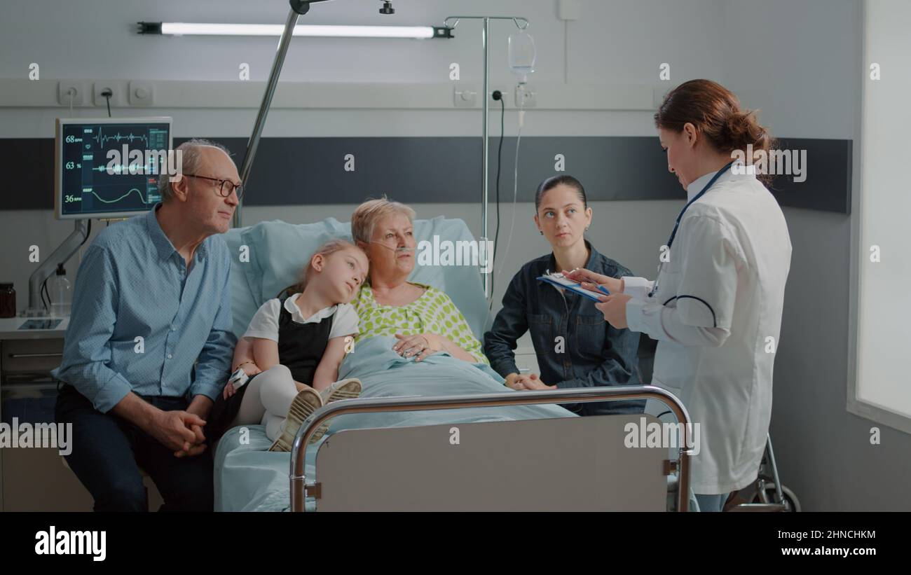 Woman doctor discussing about treatment and medicine with patient and ...