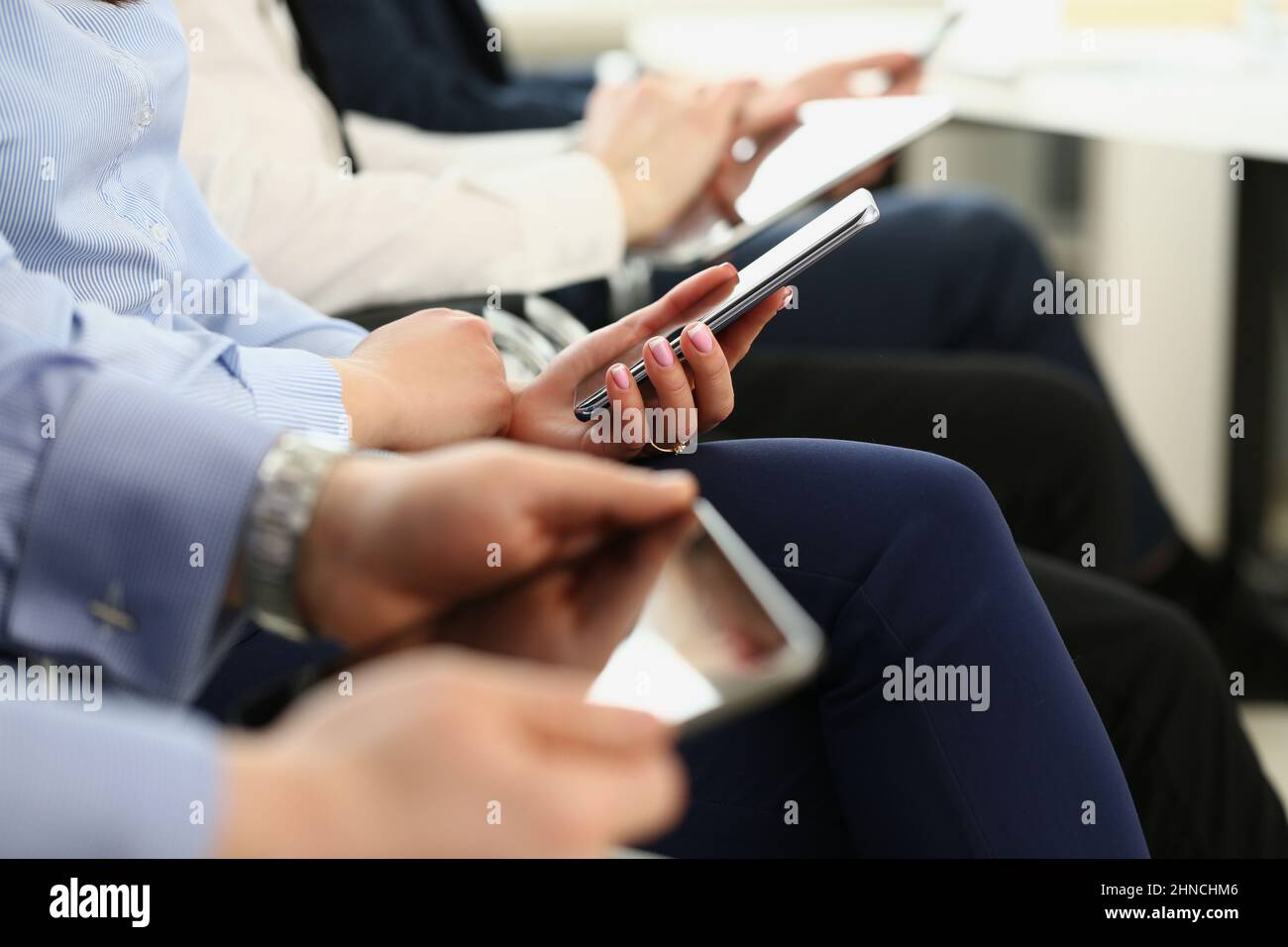 People using mobile phones on meeting, modern gadgets in work Stock ...