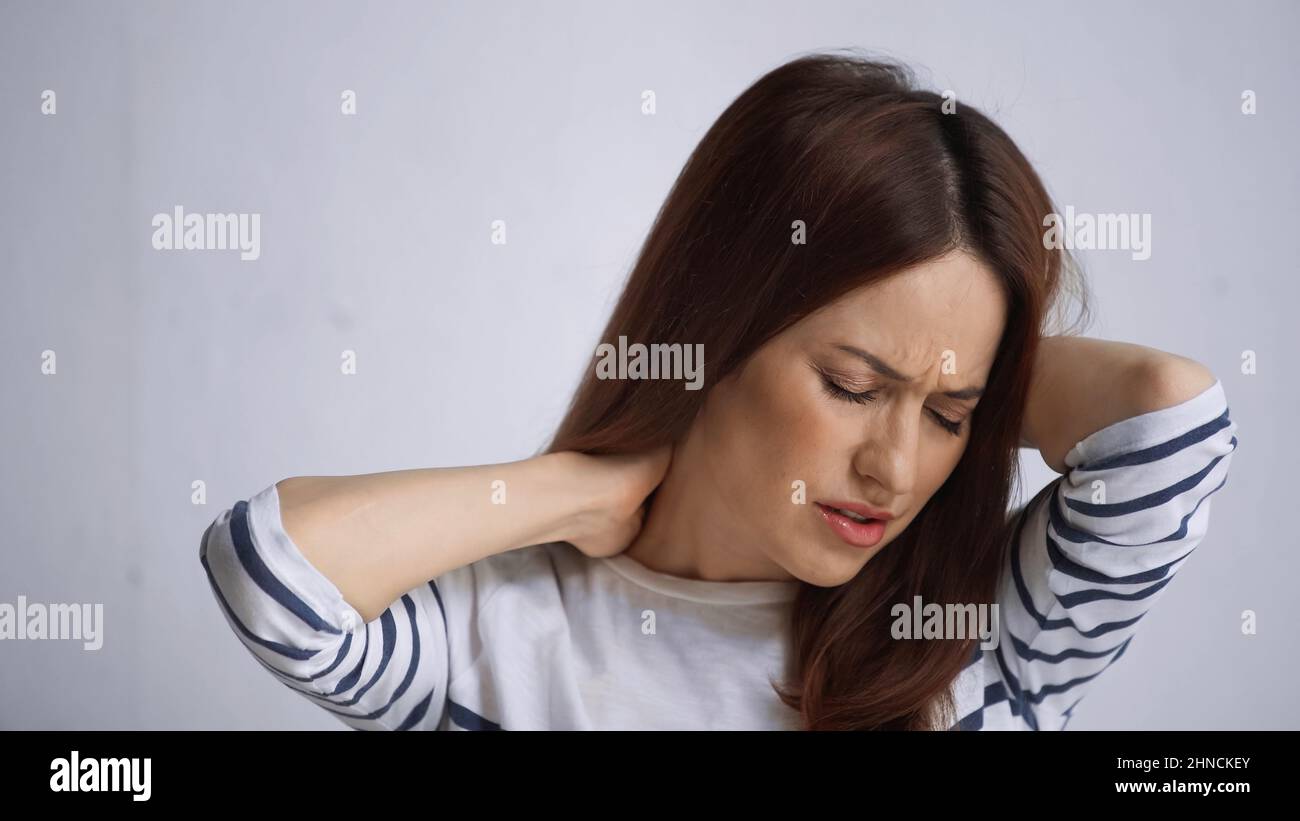 Woman touching her neck hi-res stock photography and images - Alamy