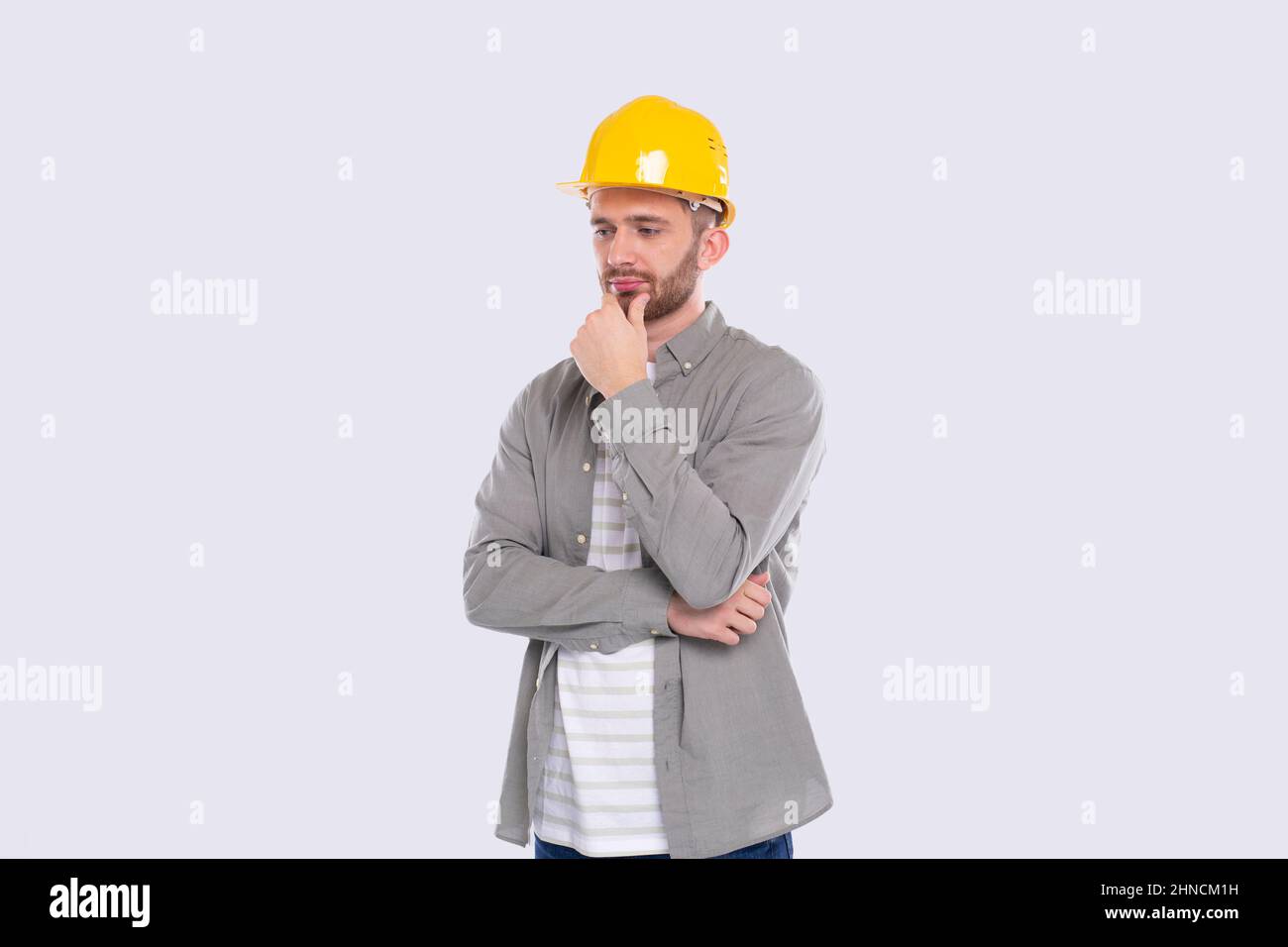 Construction Worker Standing Thinking. Architect Analysing Work. Man ...