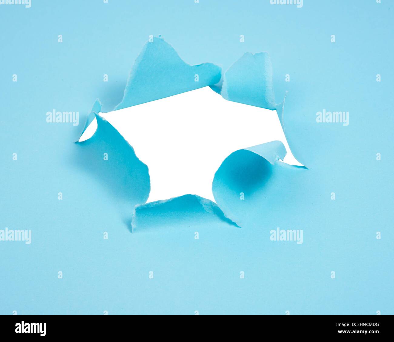 Blue torn paper whole with copyspace Stock Photo - Alamy