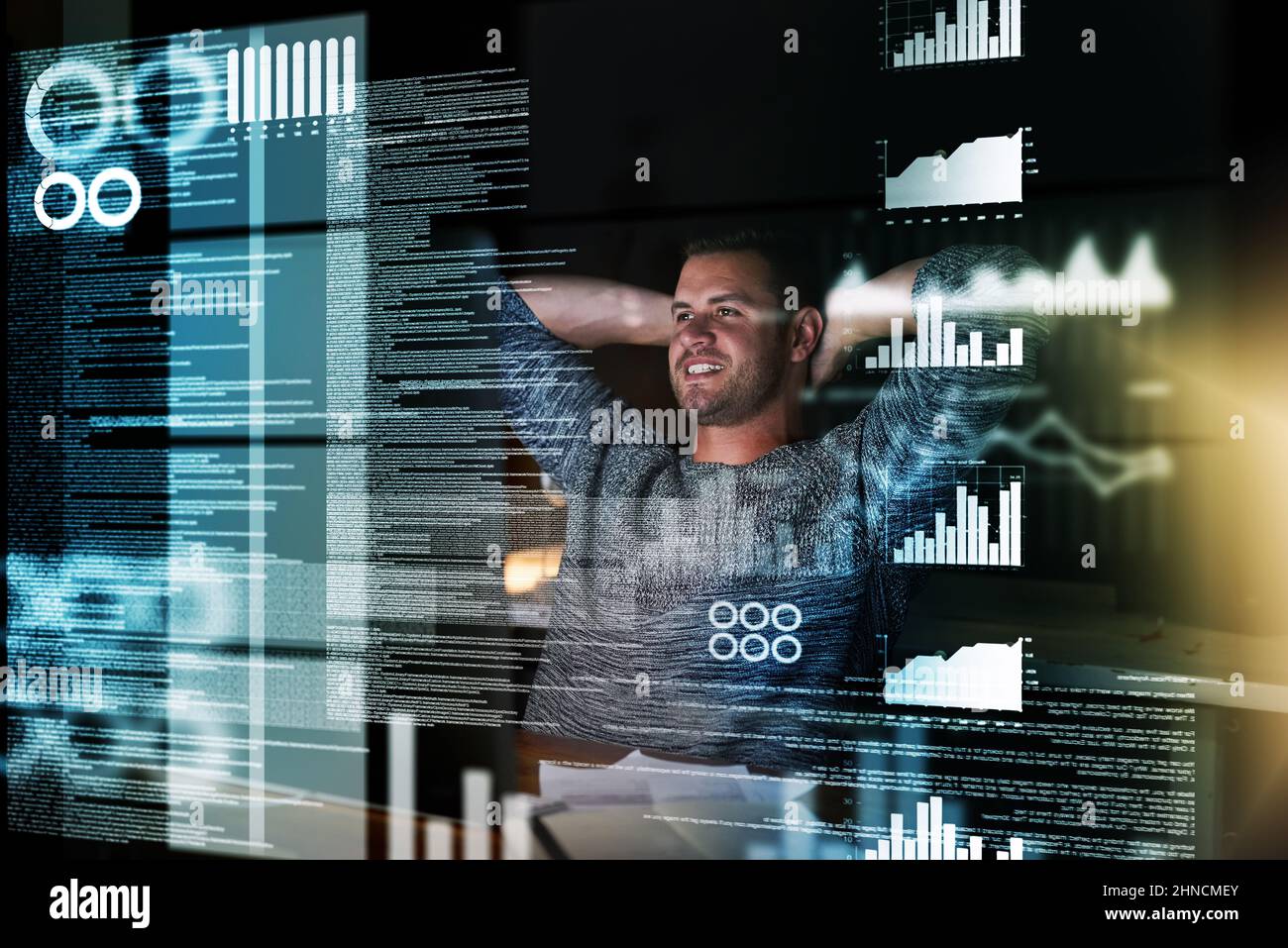 My work here is done. Shot of a smiling computer programmer working at ...