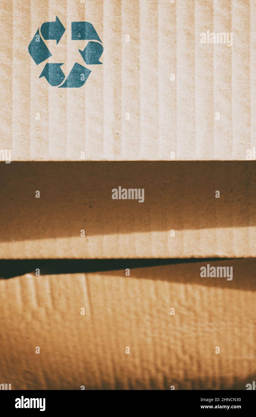 Background image of a paper board with a recycling sign Stock Photo - Alamy