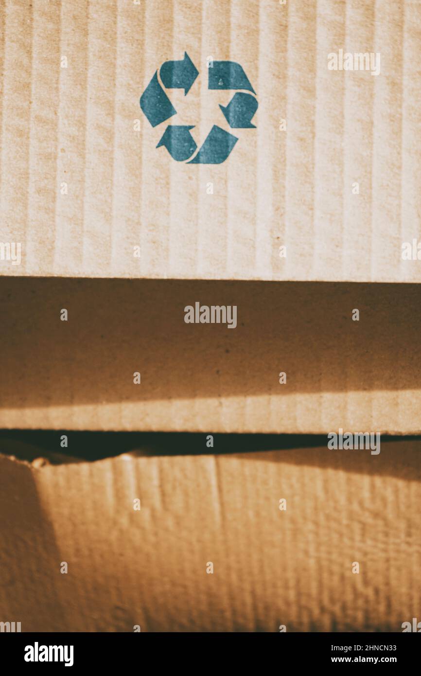 Background image of a paper board with a recycling sign Stock Photo - Alamy
