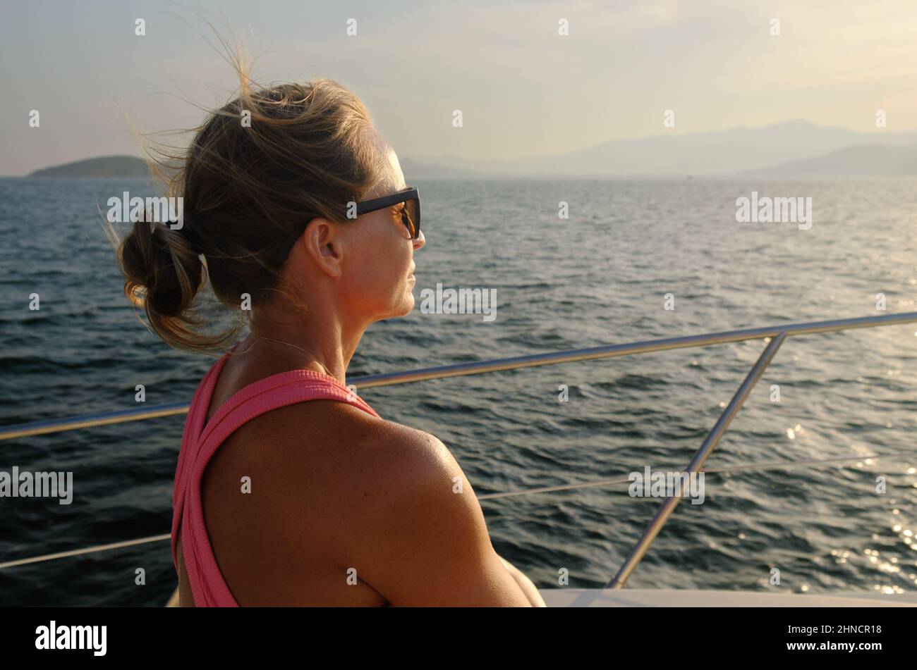 Woman floating on water sunset hi-res stock photography and images - Alamy