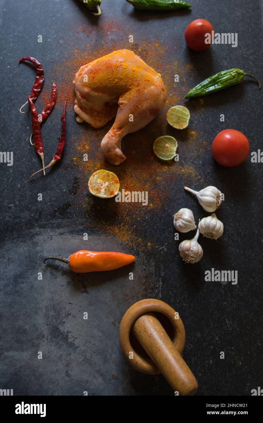 Chicken meat marinated in Indian spices. Close up Stock Photo - Alamy