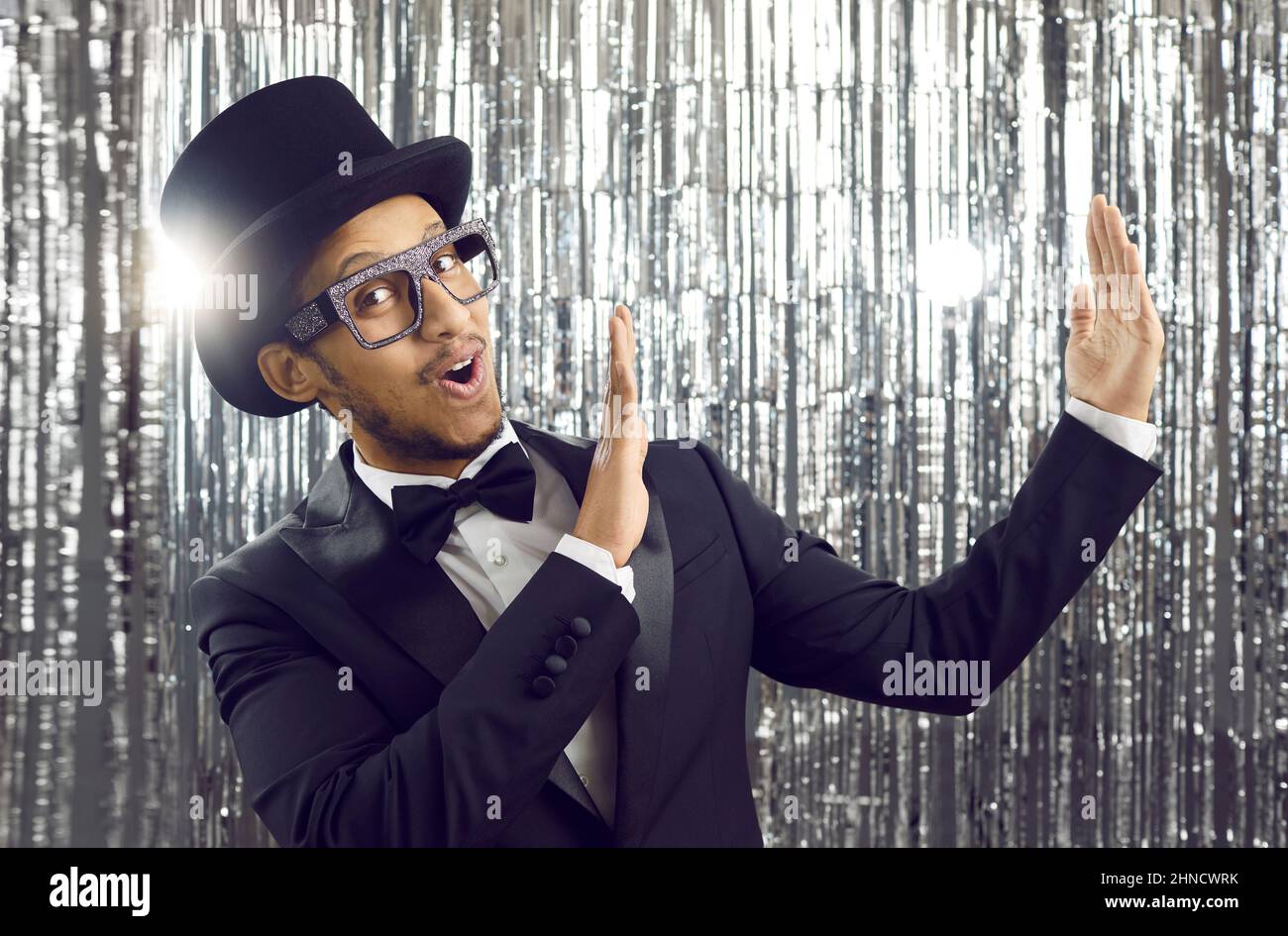 Smiling African American man magician make tricks Stock Photo - Alamy