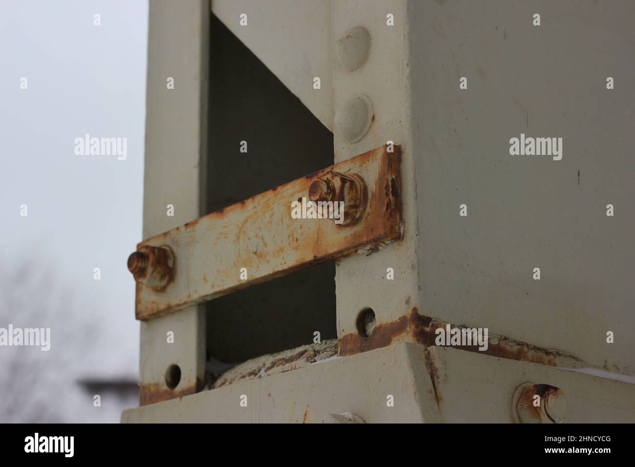 The nuts and bolts of an old worn weathered steel column constructed ...