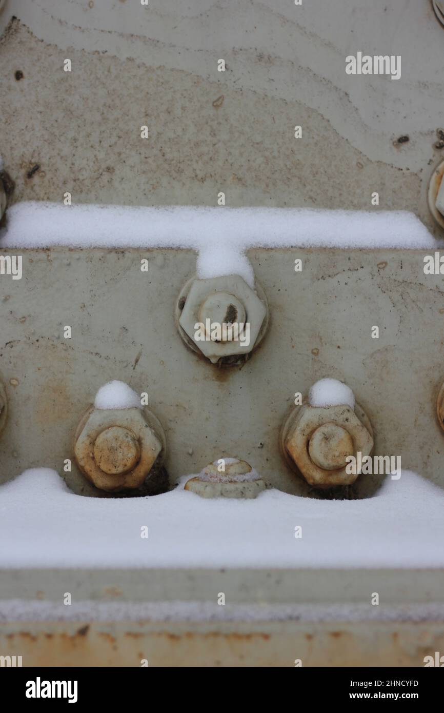 The nuts and bolts of an old worn weathered steel column constructed ...