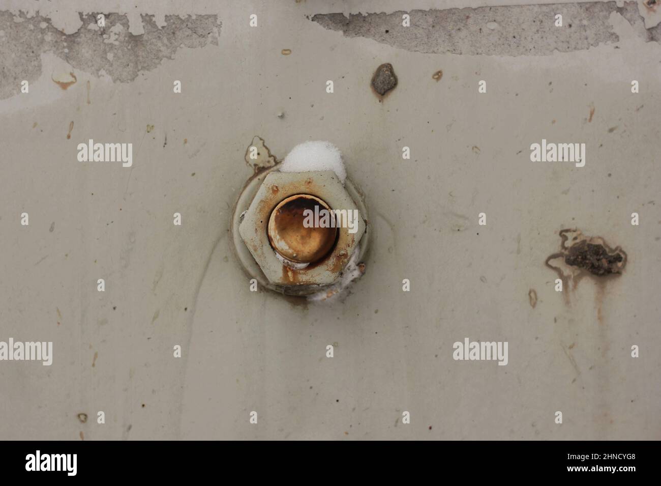 The nuts and bolts of an old worn weathered steel column constructed ...
