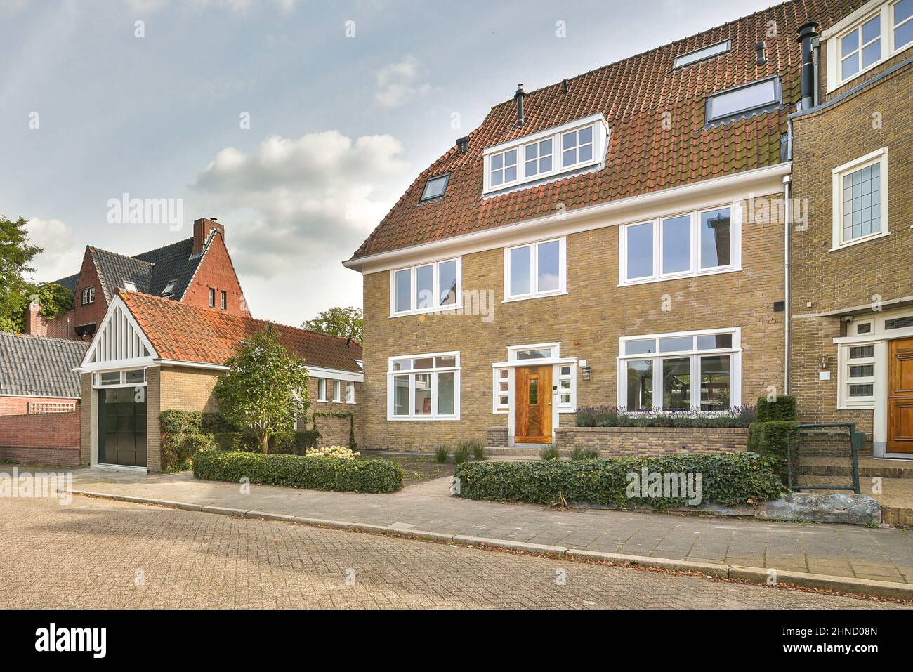 Exterior of residential building with garage located on street with ...