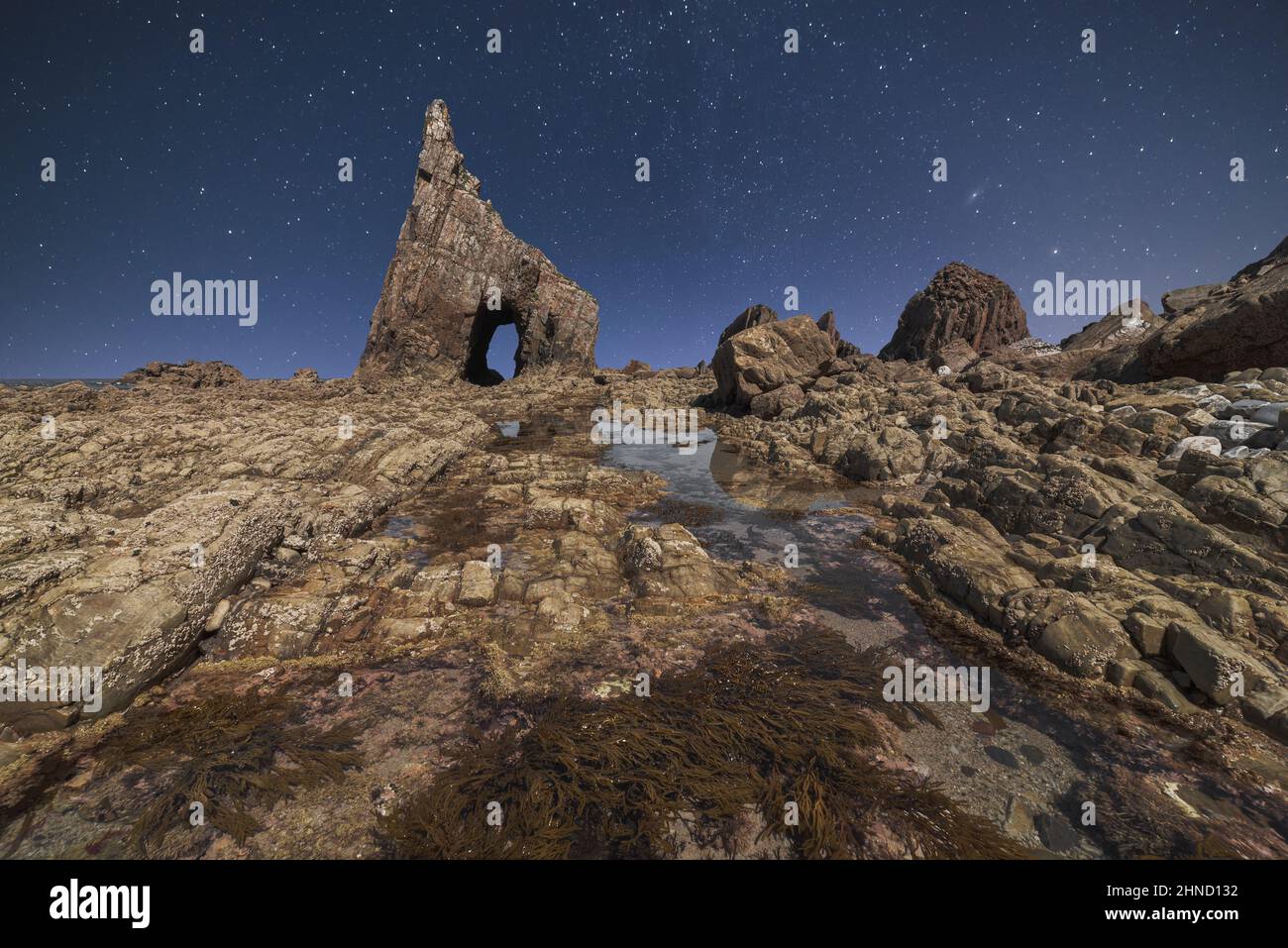Amazing view of rocks in mountains under night sky with glowing stars ...