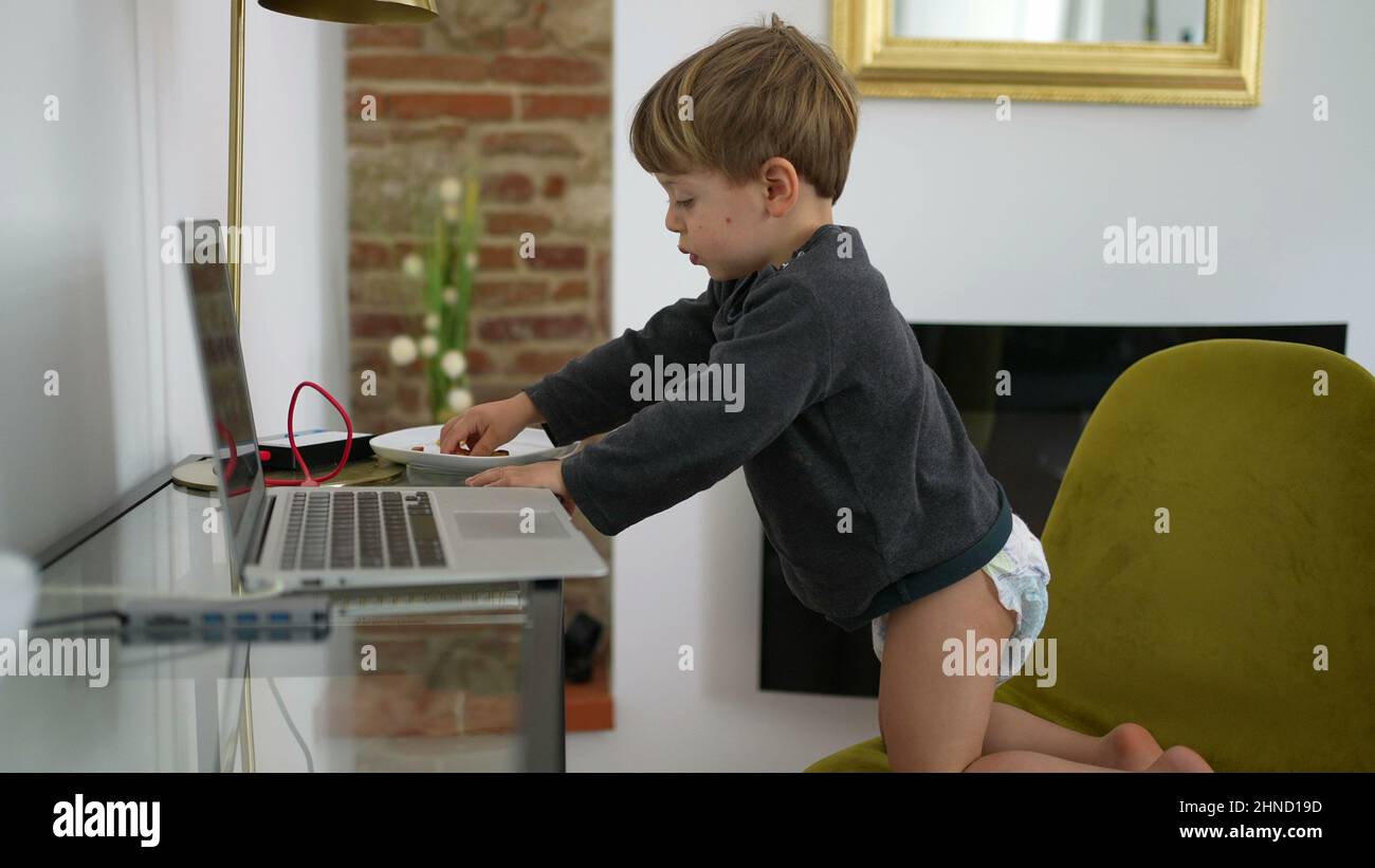 Baby boy wearing diapers in front of laptop at home 2 year old toddler ...