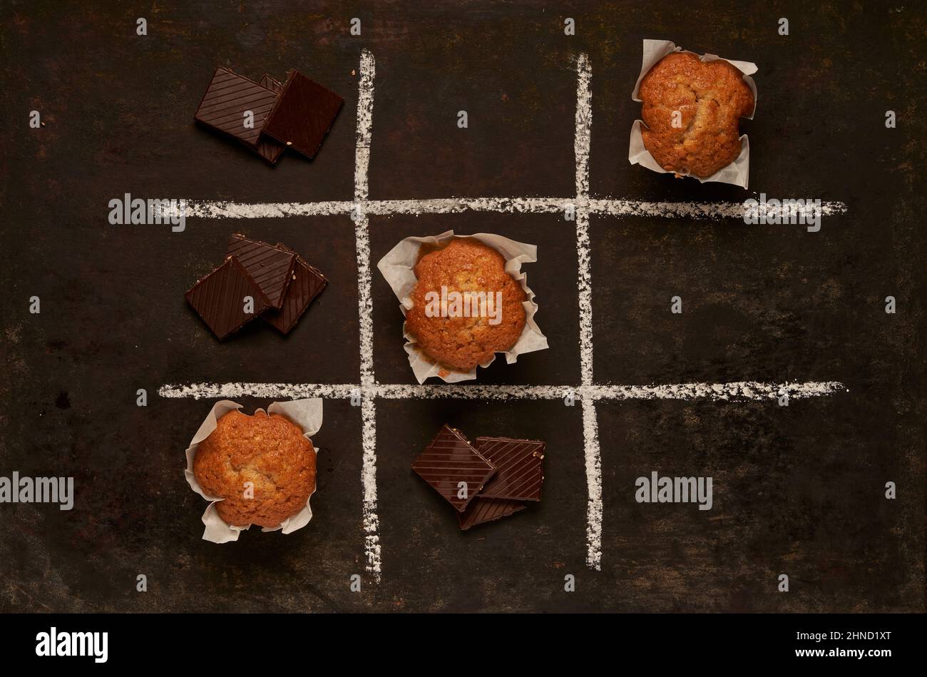 Top view of edible Tic tac toe game with baked muffins and sweet ...
