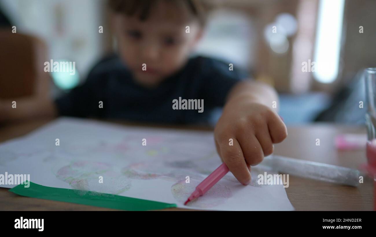 Child drawing with color pen on paper Little boy playing art and craft ...