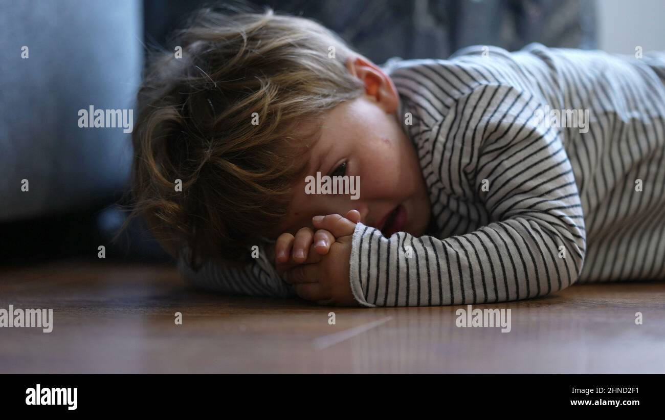 Child crying on floor having tantrum little boy cries Stock Photo - Alamy