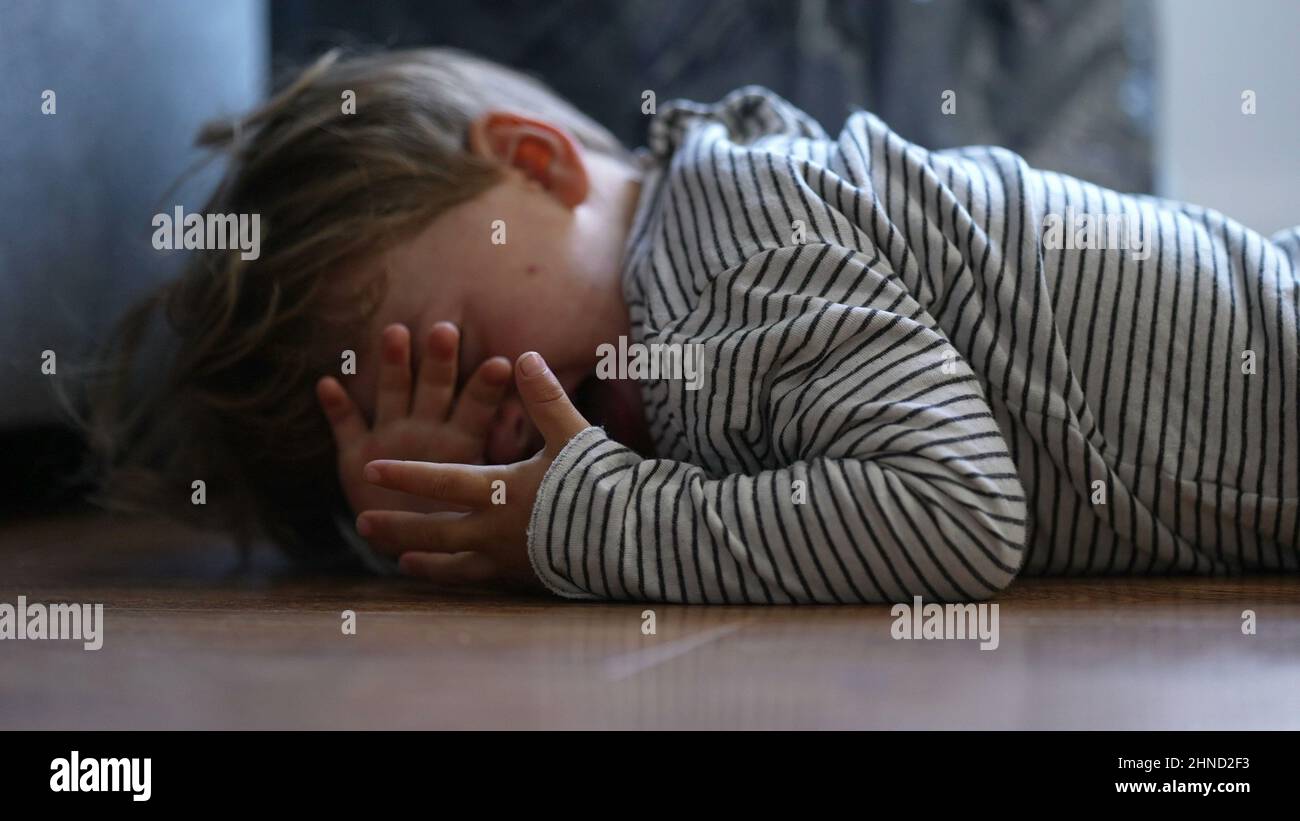 Child crying on floor having tantrum little boy cries Stock Photo - Alamy