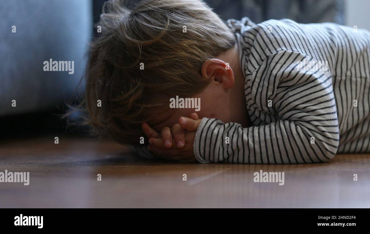 Child crying on floor having tantrum little boy cries Stock Photo - Alamy