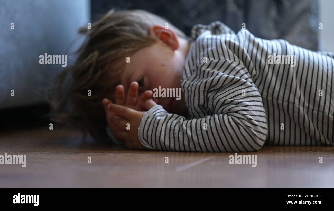 Child crying on floor having tantrum little boy cries Stock Photo - Alamy