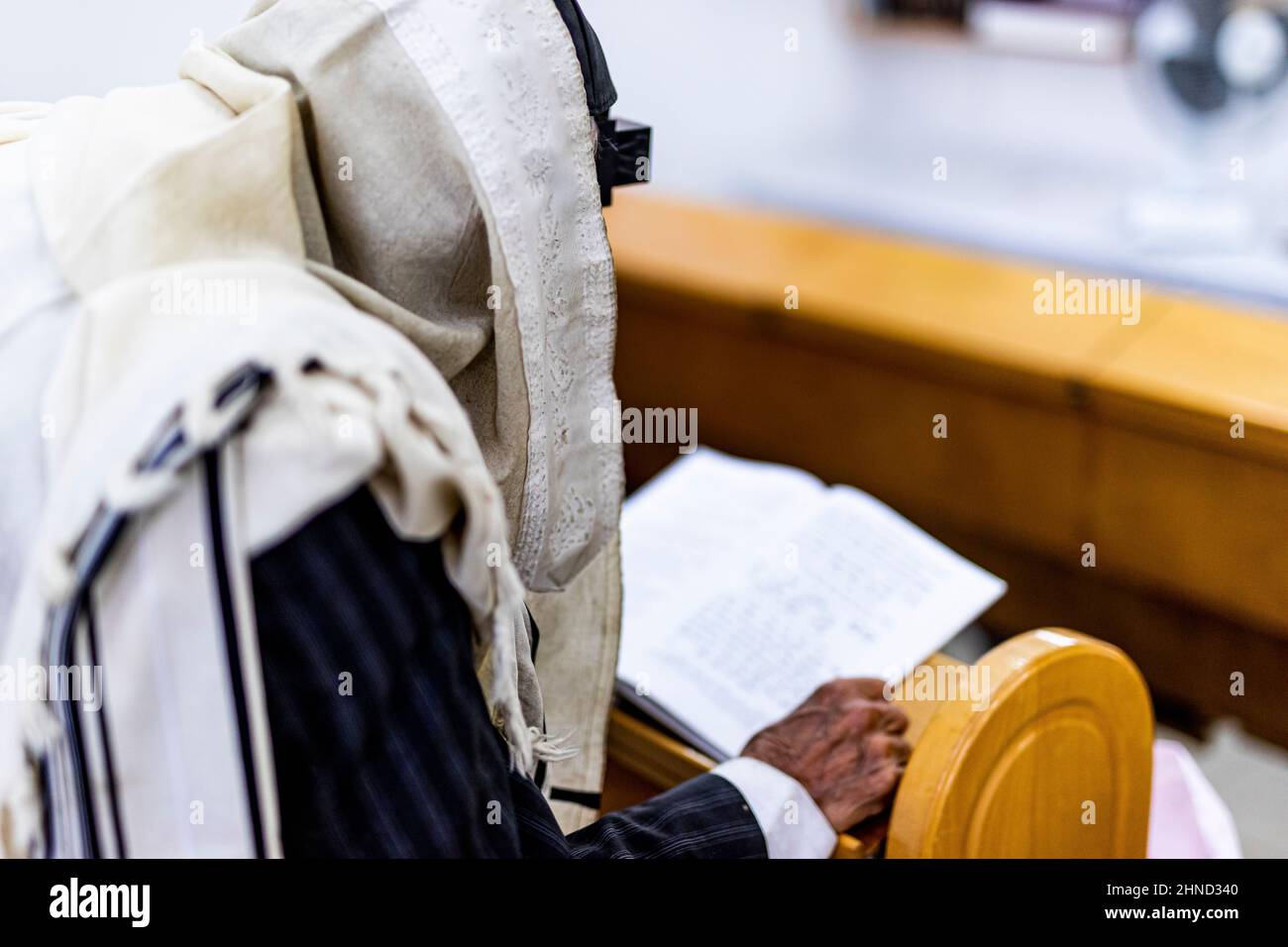 Aliyah to torah. Man in the temple celebration of bar mitzvah man is ...