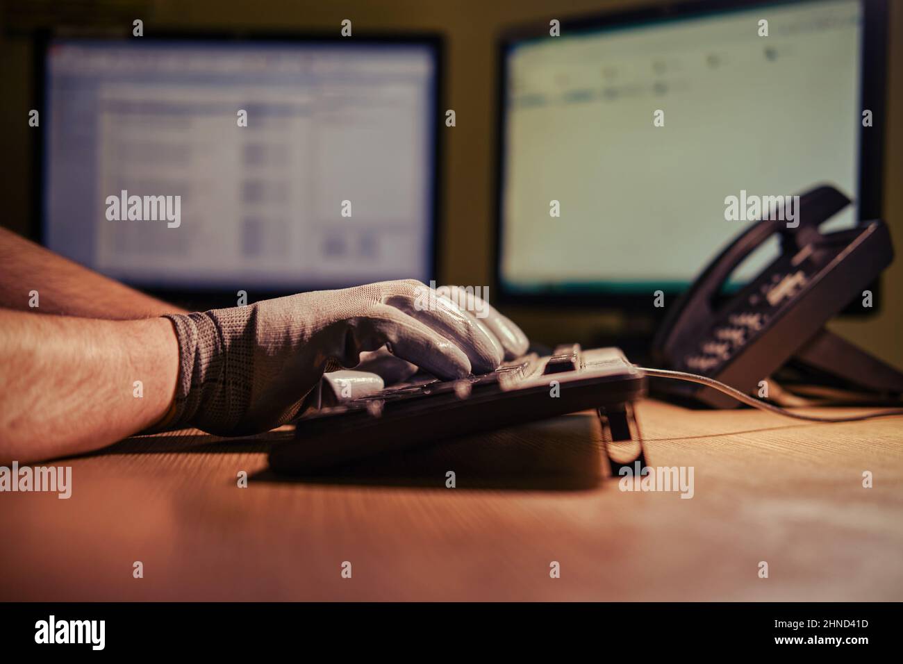 Computer keyboard hands gloves typing hi-res stock photography and ...