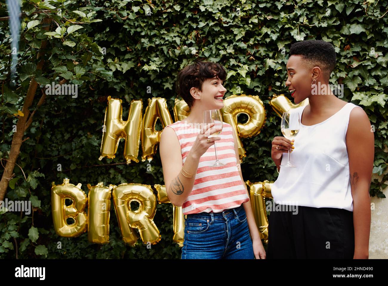 Celebrating outdoors friends balloons hi-res stock photography and ...