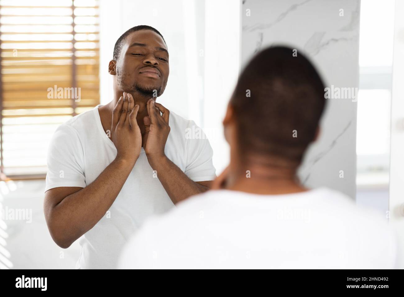 Healthcare Concept. Worried Black Man Touching Neck, Examining Lymph ...
