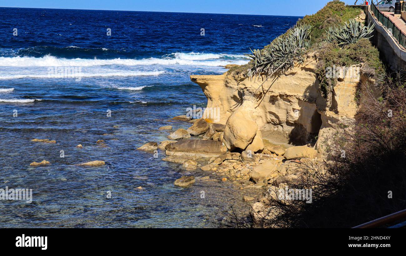 A cliff, cave and sea Stock Photo - Alamy
