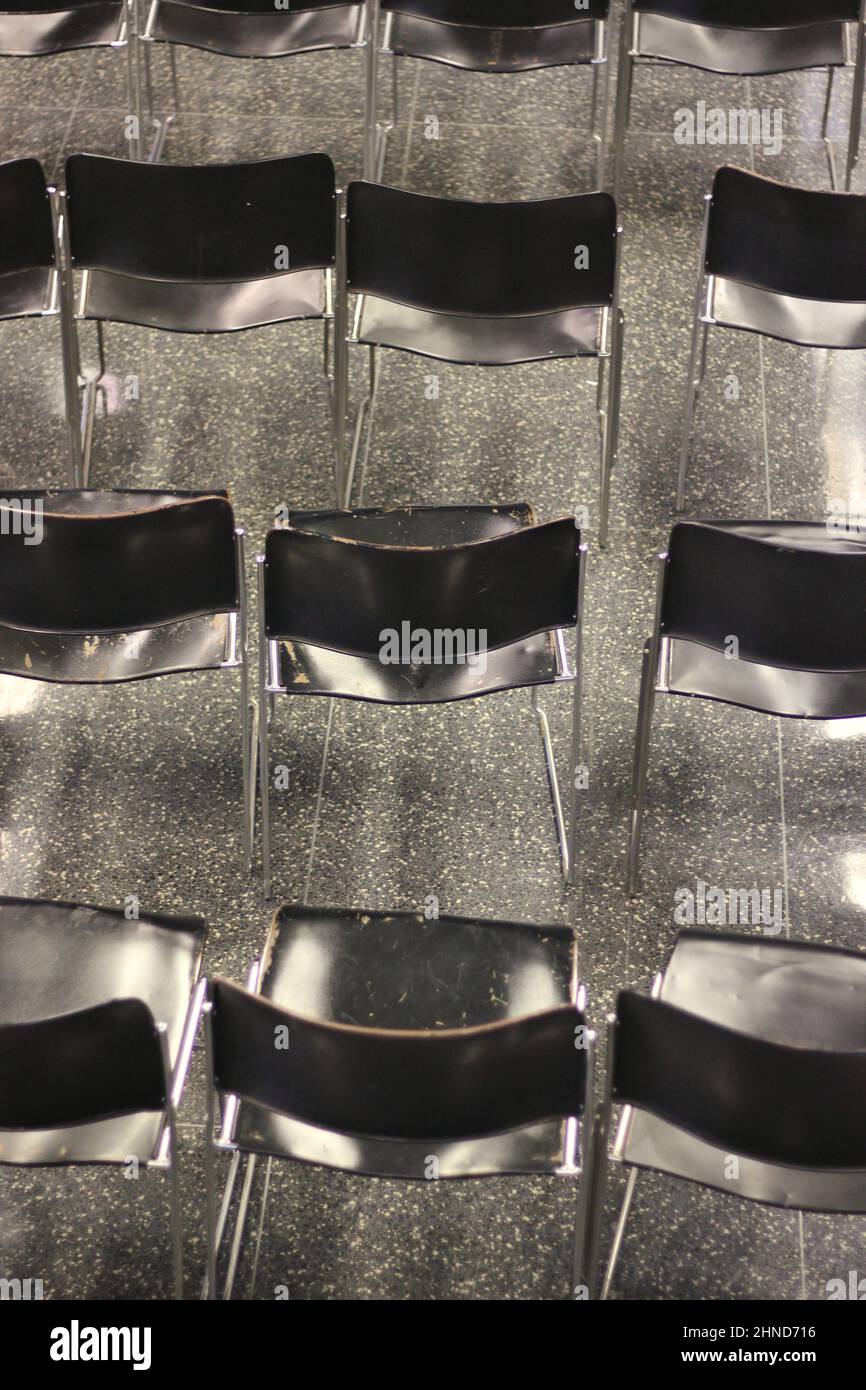 Many rows of empty chairs set up for a lecture Stock Photo - Alamy