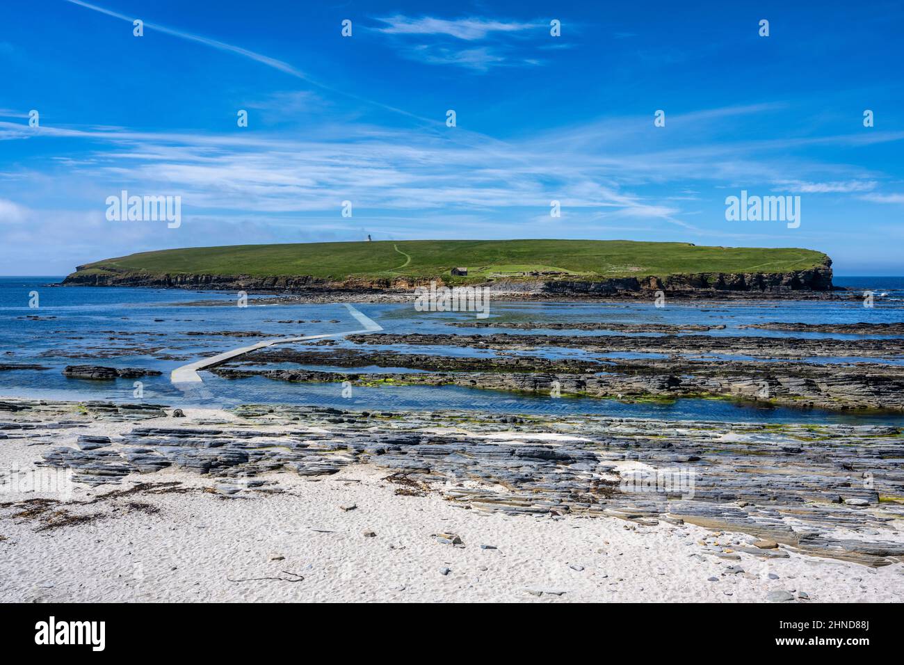 Partly submerged causeway leading to the Brough of Birsay, an ...