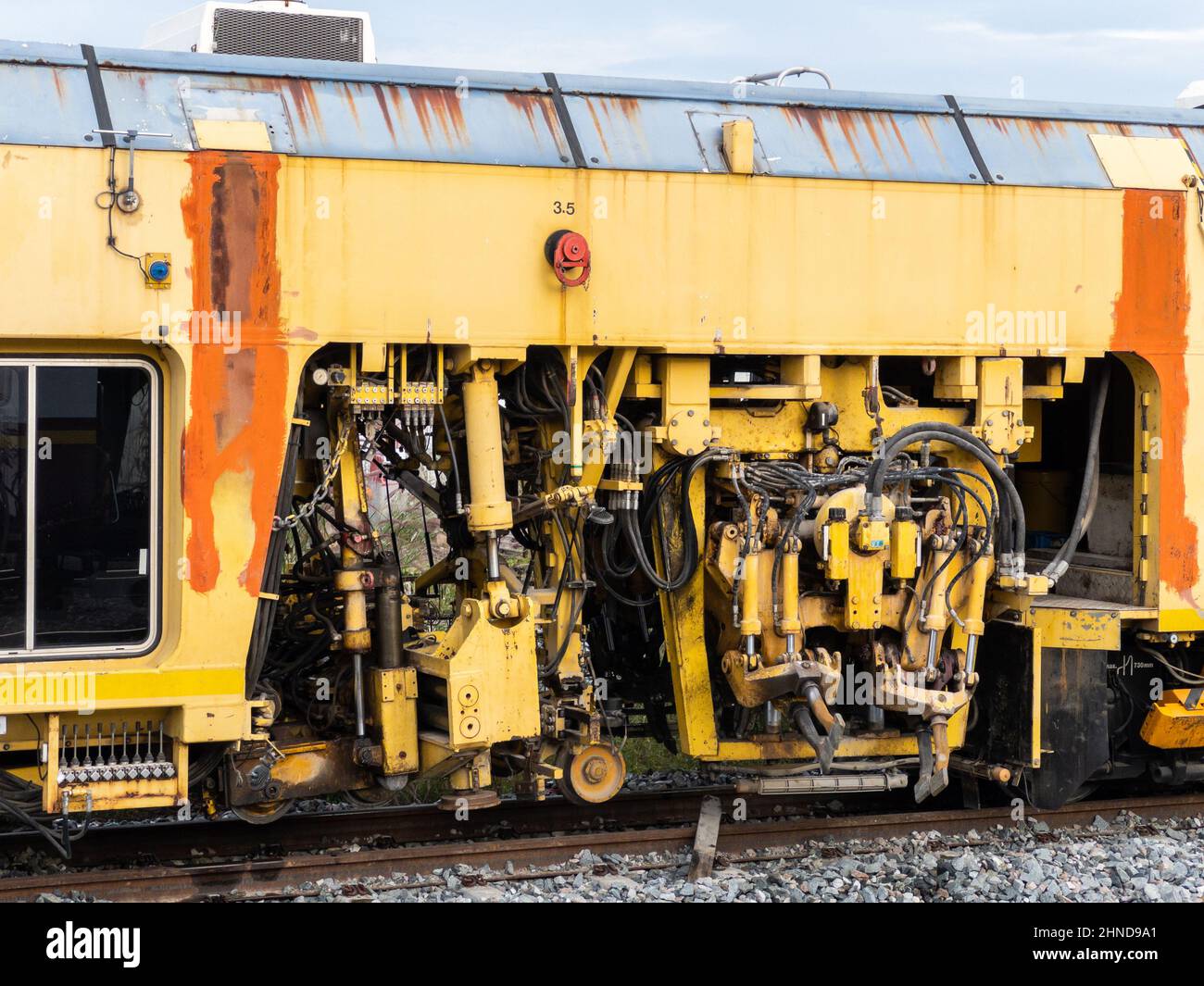 The ballast tamping machine is working to maintain the sleeper and ...