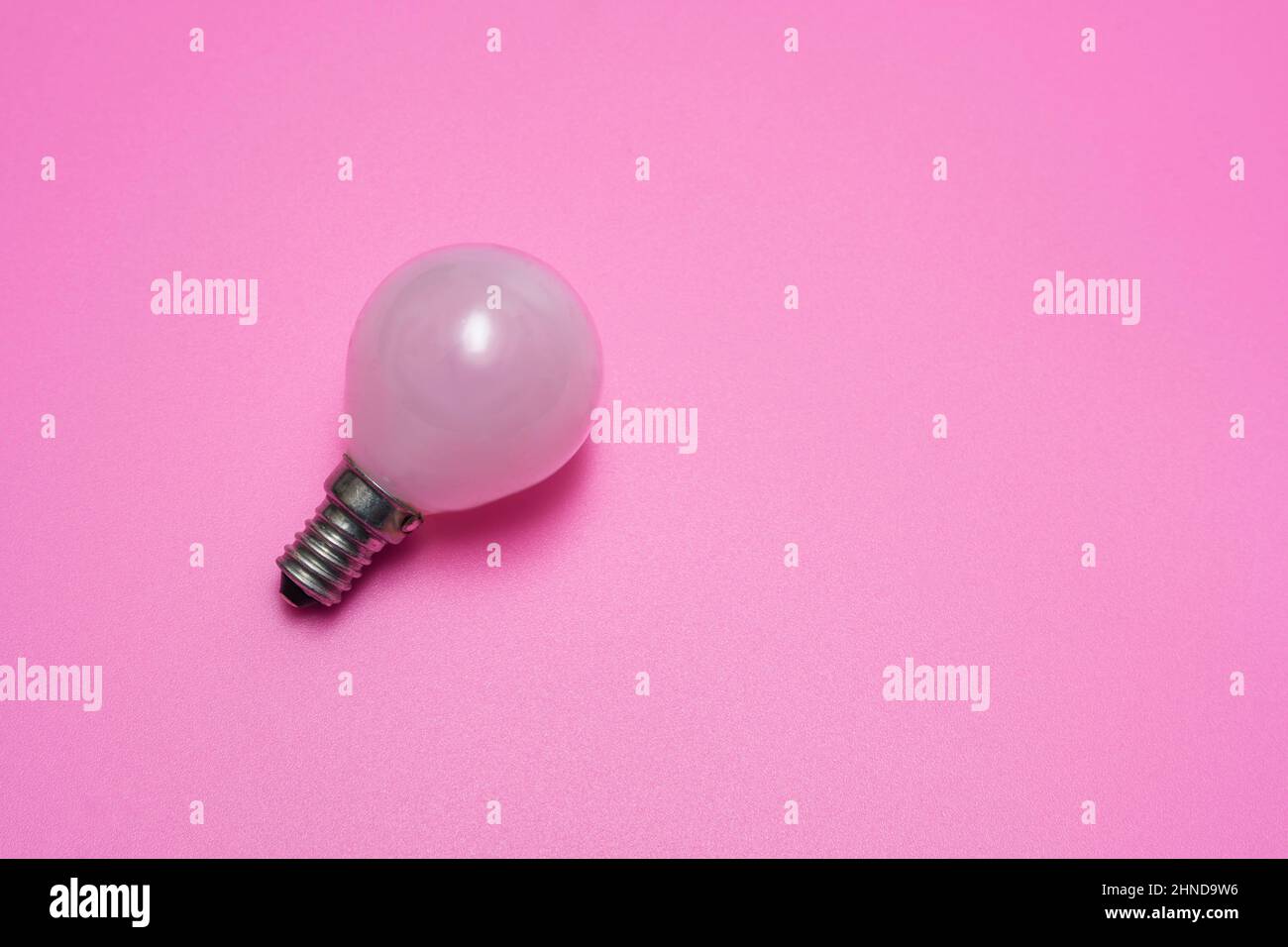 White minion light bulb on pink background,White minion light bulb on ...