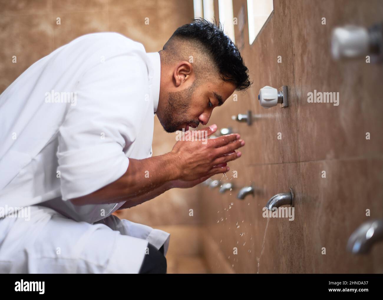 Muslim washing face hi-res stock photography and images - Alamy