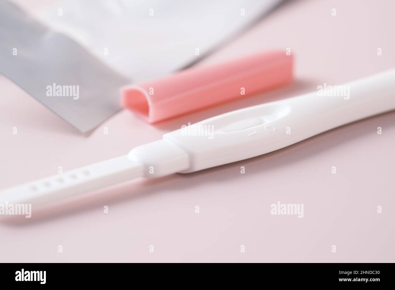 Pregnancy test kit and plastic packet on light color background Stock ...