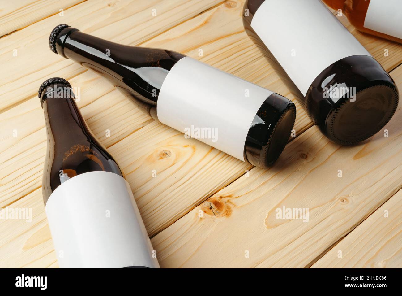 Beer bottle on a brown wooden table flat lay background with a copy ...
