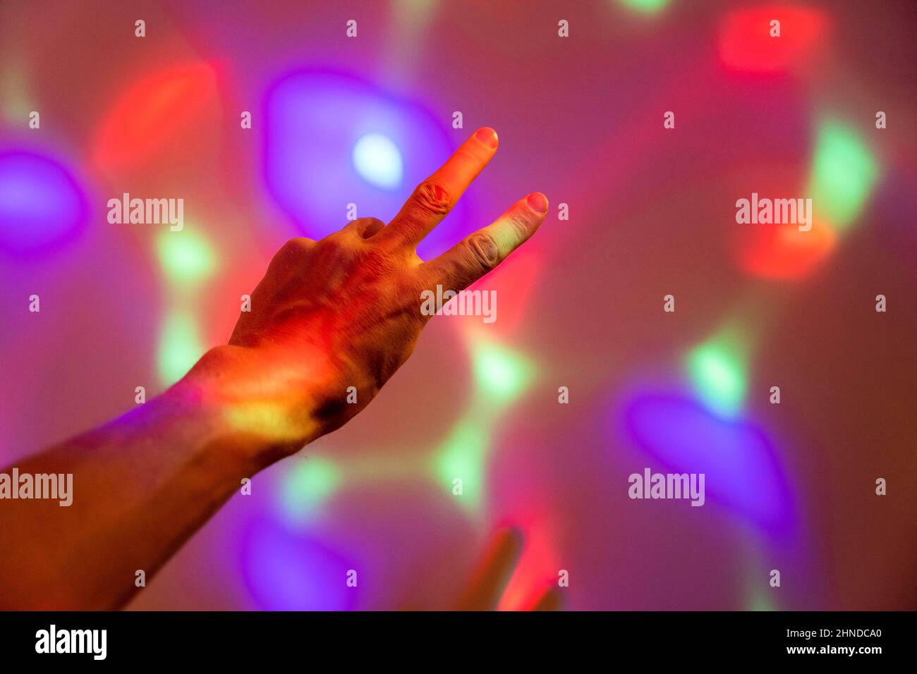 The man's hand shows the sign of freedom, victoria, against the ...