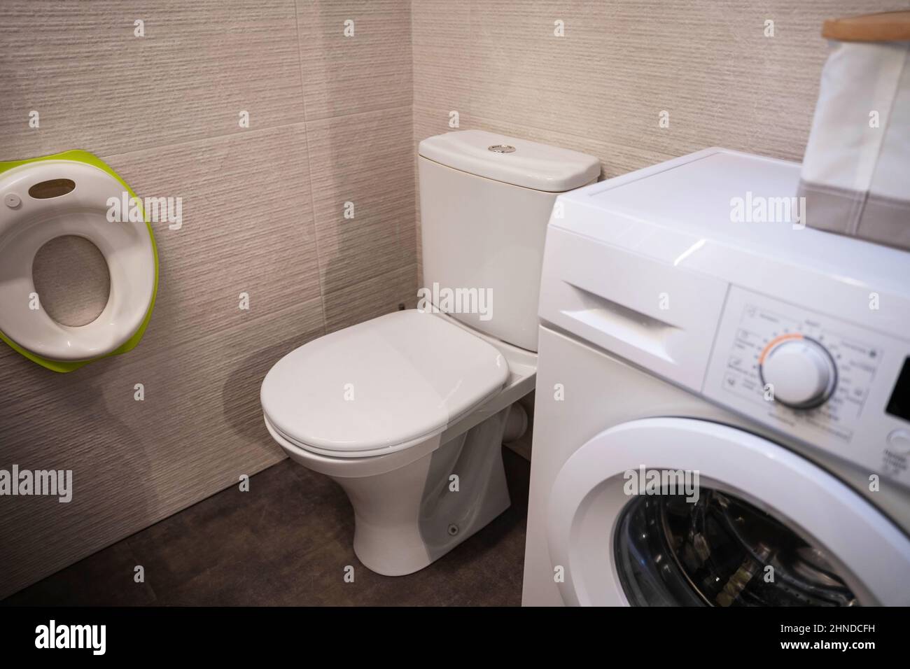 The furniture of the home toilet, toilet and washing machine, a seat ...