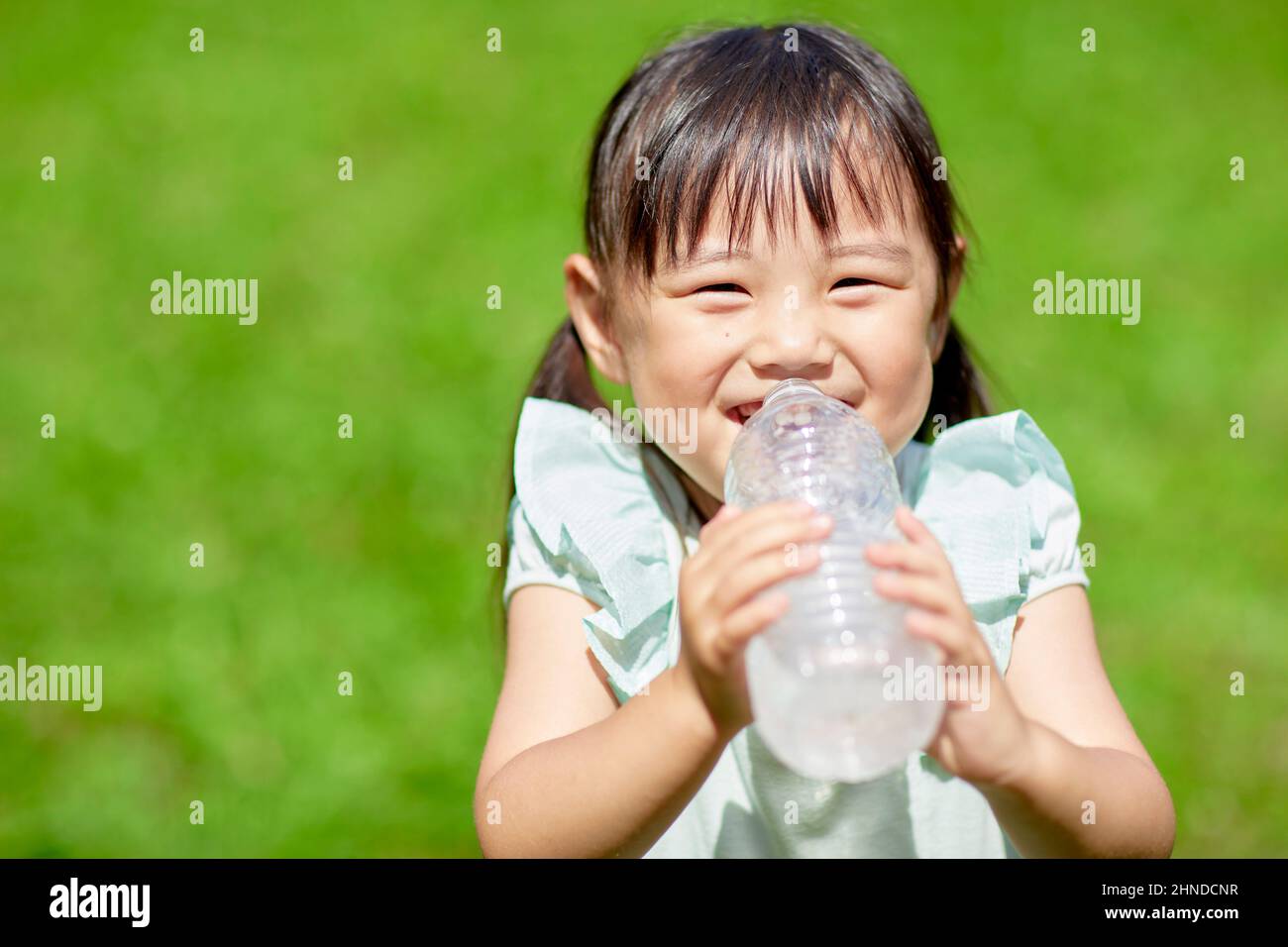 Child drinking pet bottle hi-res stock photography and images - Alamy