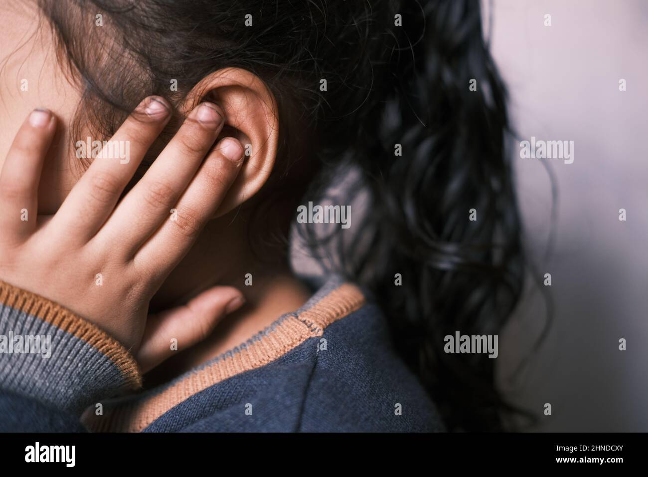 child girl having ear pain touching his painful ear Stock Photo - Alamy