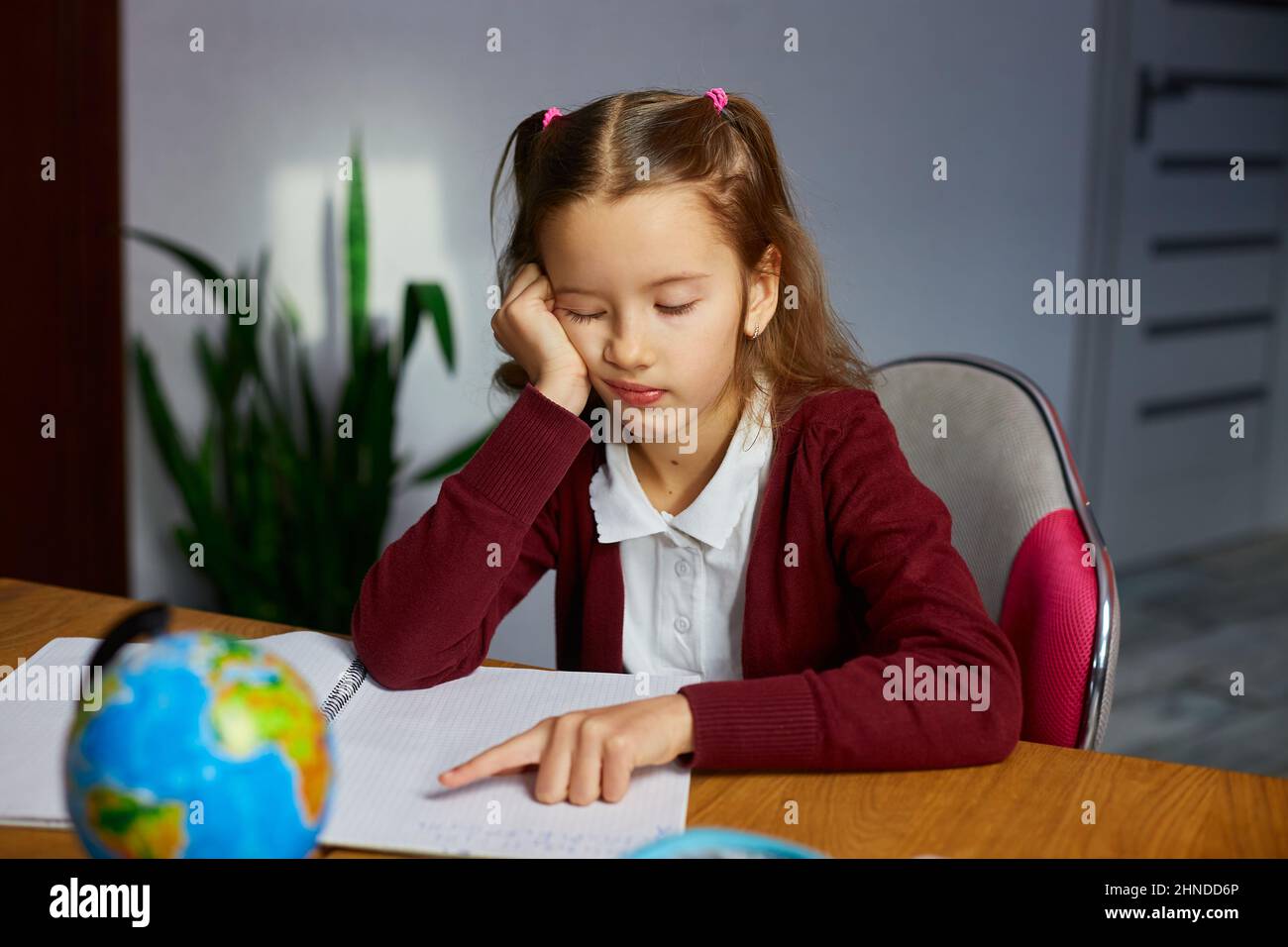 Tired student girl doing homework hi-res stock photography and images ...