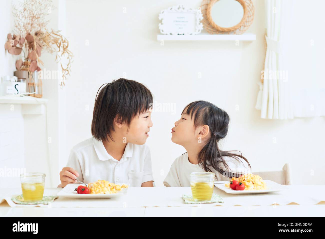 Japanese Brother And Sister Facing Each Other Stock Photo - Alamy