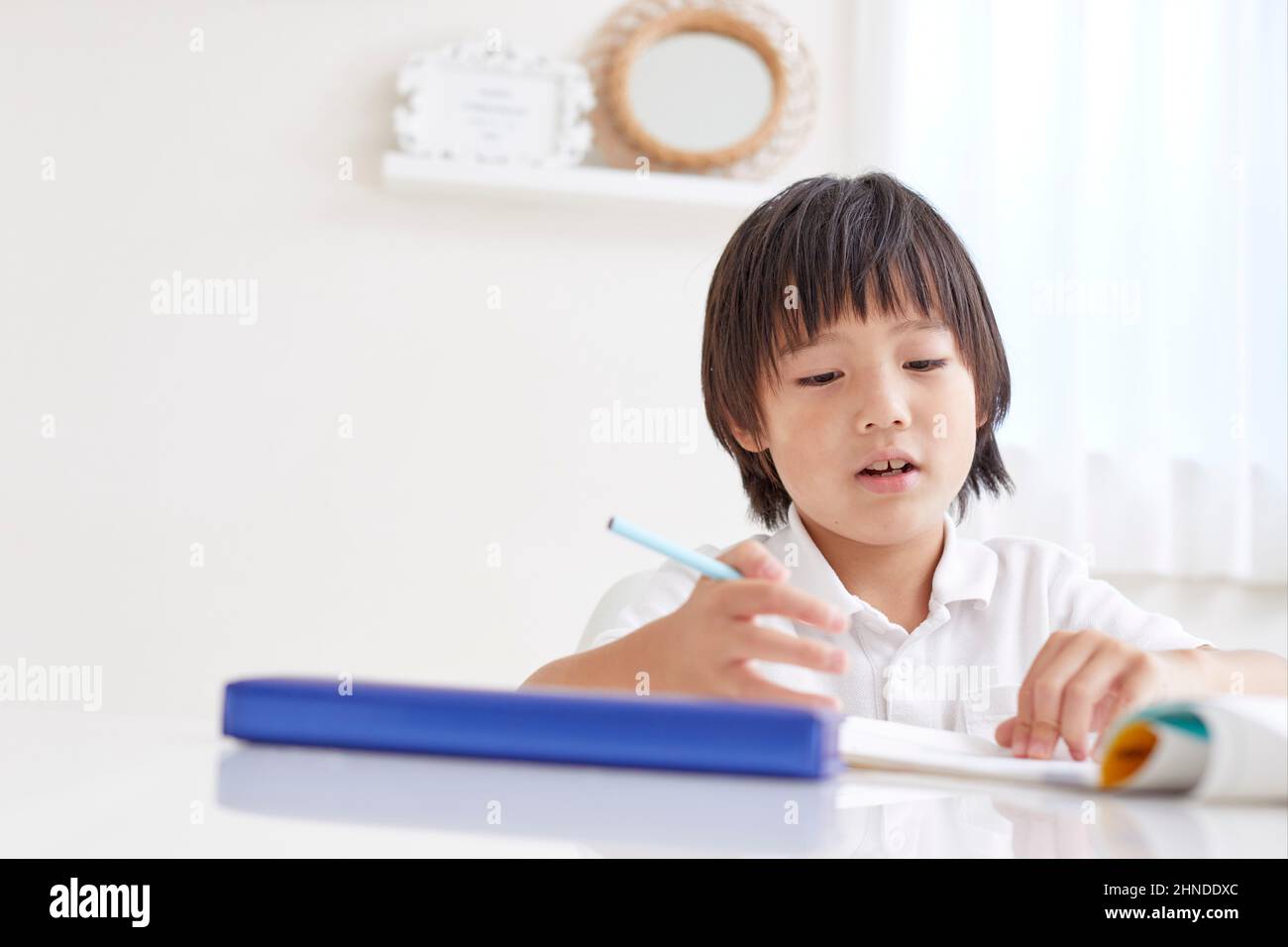Japanese Elementary School Boy Doing His Homework Stock Photo - Alamy