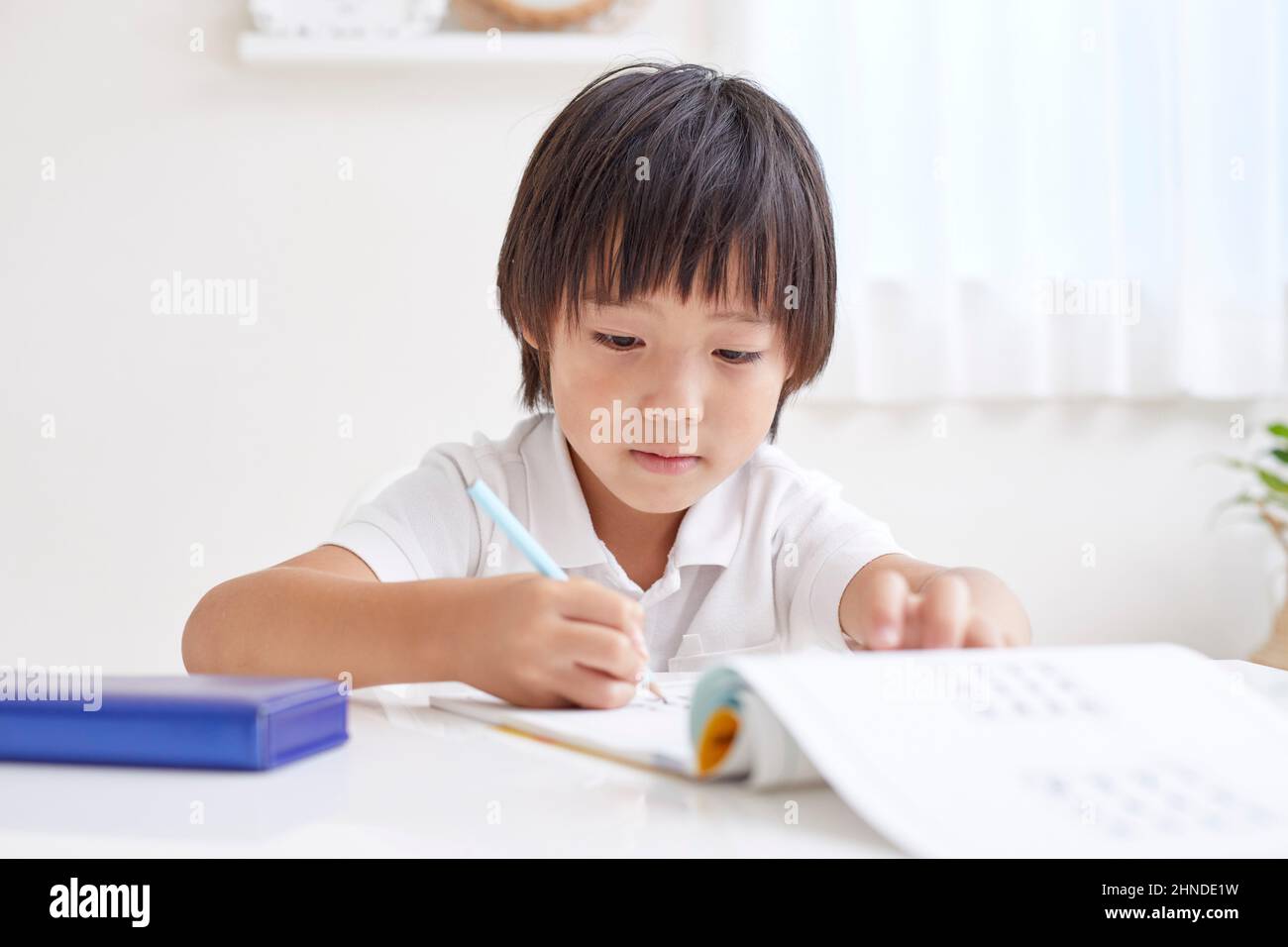 Japanese Elementary School Boy Doing His Homework Stock Photo - Alamy