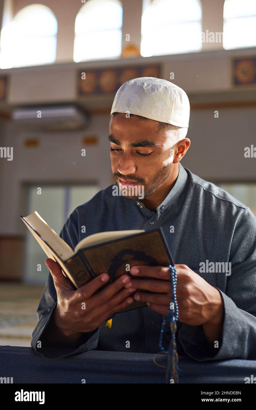 Muslim man reading quran in the mosque hi-res stock photography and ...